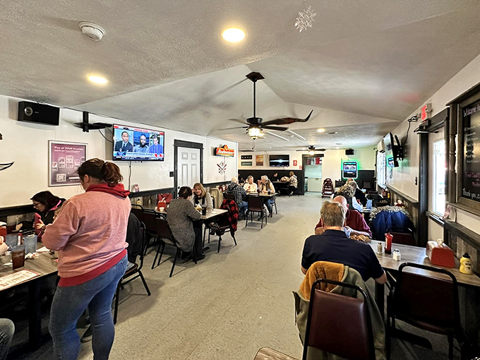 Where strangers become neighbors and neighbors become family. The dining room hums with the soundtrack of small-town America.
