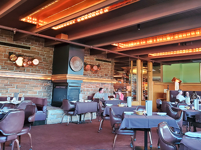 Warm lighting, stone walls, and copper accents create the perfect backdrop for decisions that matter: rare, medium, or medium-rare?