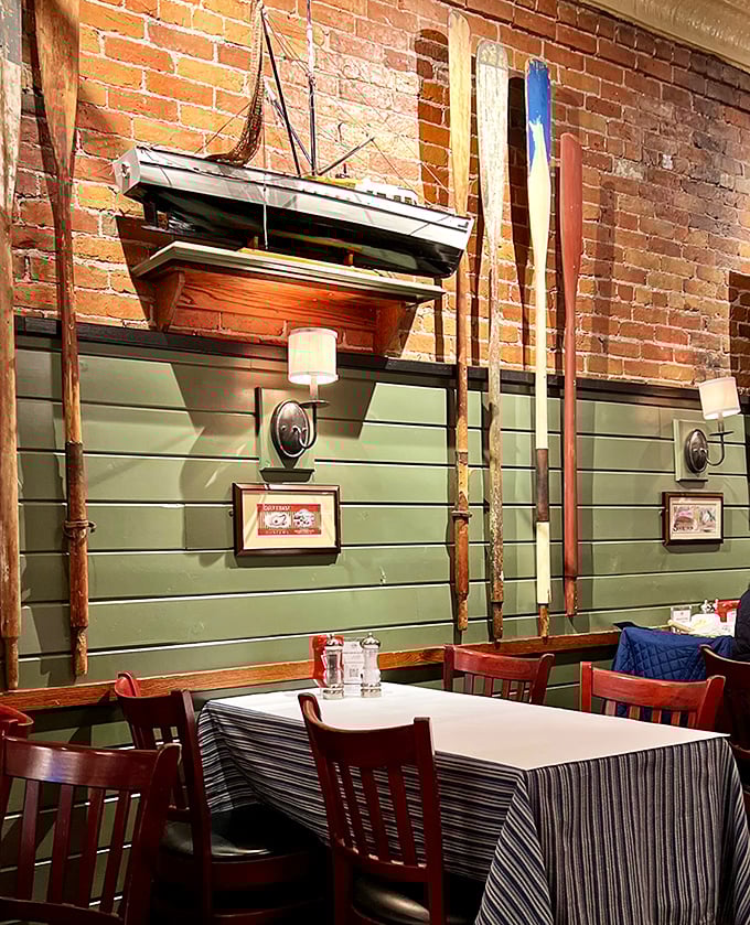 Nautical touches like model boats add character without feeling forced, creating authenticity that theme restaurants can only dream about achieving.