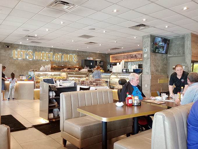 The deli counter gleams under soft lighting as diners settle into comfortable booths. Mo's perfects that delicate balance between bustling energy and relaxed dining.