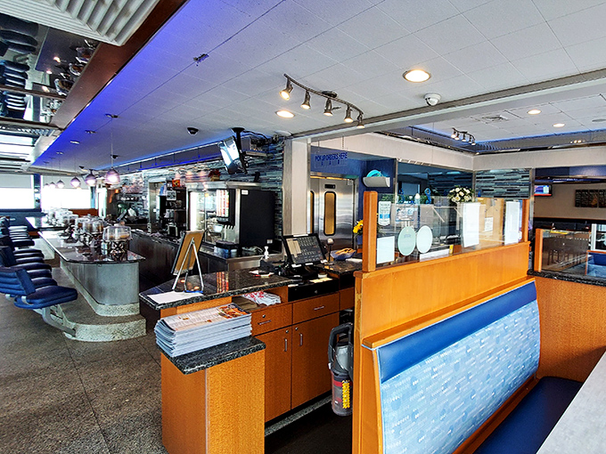 The counter and kitchen view &ndash; where diner magic happens. Blue accents and warm lighting create that unmistakable Pennsylvania diner atmosphere.