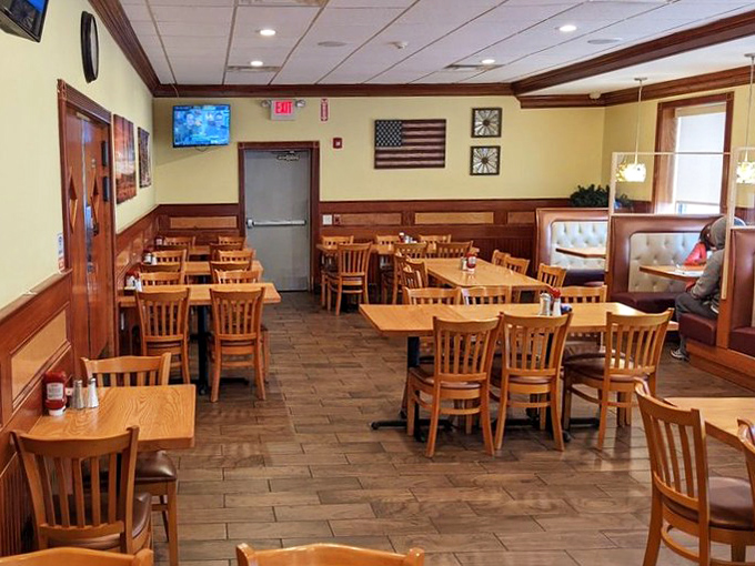 Wood paneling, American flags, and plenty of seating create that classic diner environment where everyone from truckers to teachers feels equally at home.