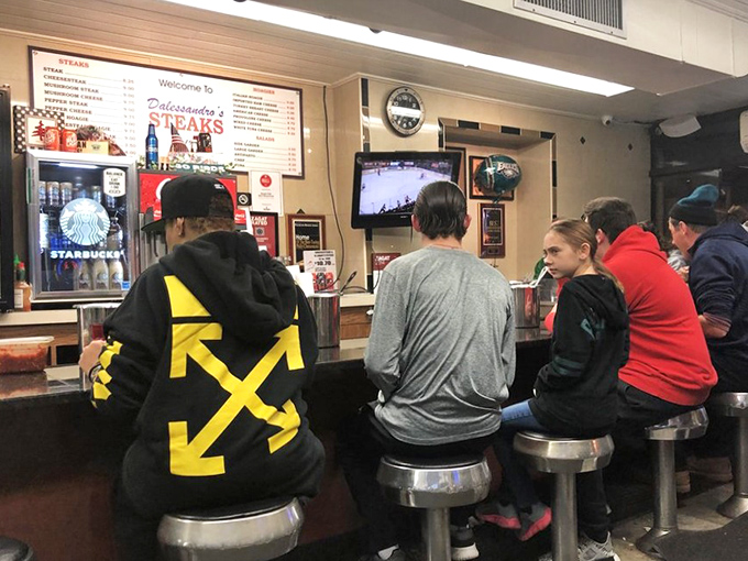 Sports on TV, strangers sharing tables, and cheesesteaks bringing everyone together. This is Philadelphia's version of communion.