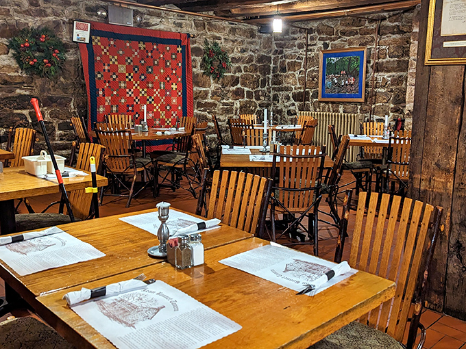 Colonial-era quilts and early American flags add authentic charm to a dining room where history feels less like a textbook and more like home.