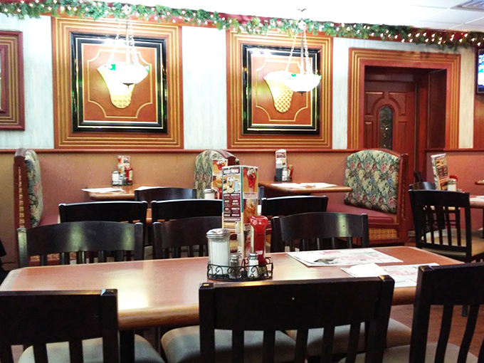 Booth seating: where strangers become neighbors and neighbors become family. The padded seats say "stay awhile" while the coffee says "stay awake."