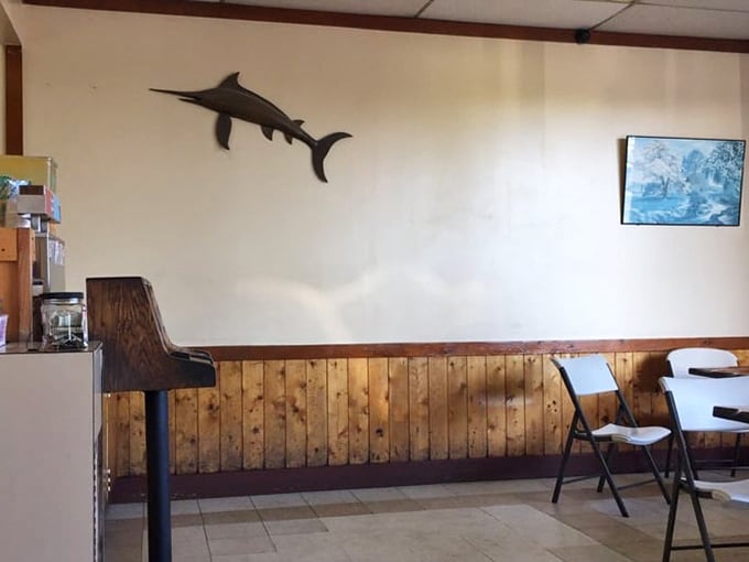 That swordfish on the wall isn't decoration &ndash; it's a maritime sentinel guarding the sacred traditions of proper fish frying.