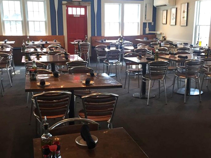 The dining room's nautical blues and warm woods create the perfect backdrop for seafood feasts that make strangers into friends.