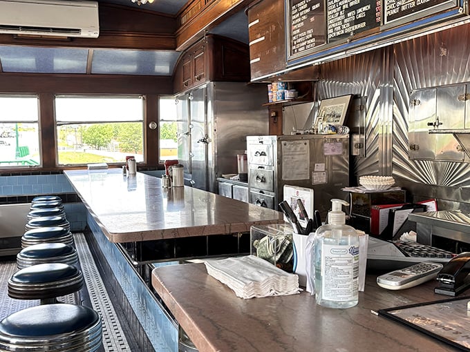 The counter view from the other side &ndash; where blue stools await the hungry and stainless steel gleams with the promise of good things to come.