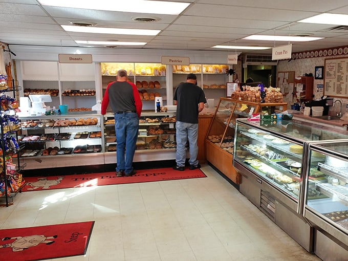 Where the magic happens. Two customers contemplating life's most important question: "How many pies can I reasonably fit in my car?"