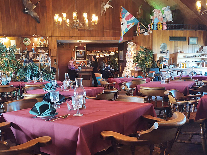 The bar serves as command central, where skilled hands craft cocktails beneath chandeliers and conversation flows freely.