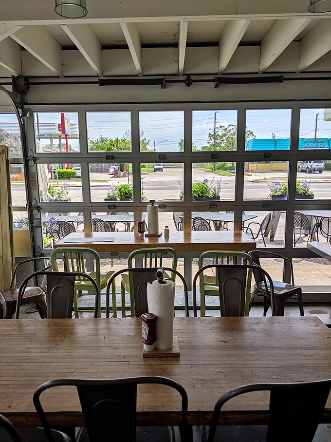 Sunlight streams through the garage windows, illuminating wooden tables where countless conversations and sandwich revelations have occurred.