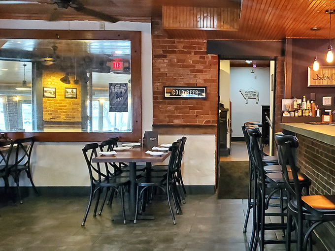 Exposed brick walls and industrial touches create a space that feels both modern and timeless, like comfort food with a college degree.