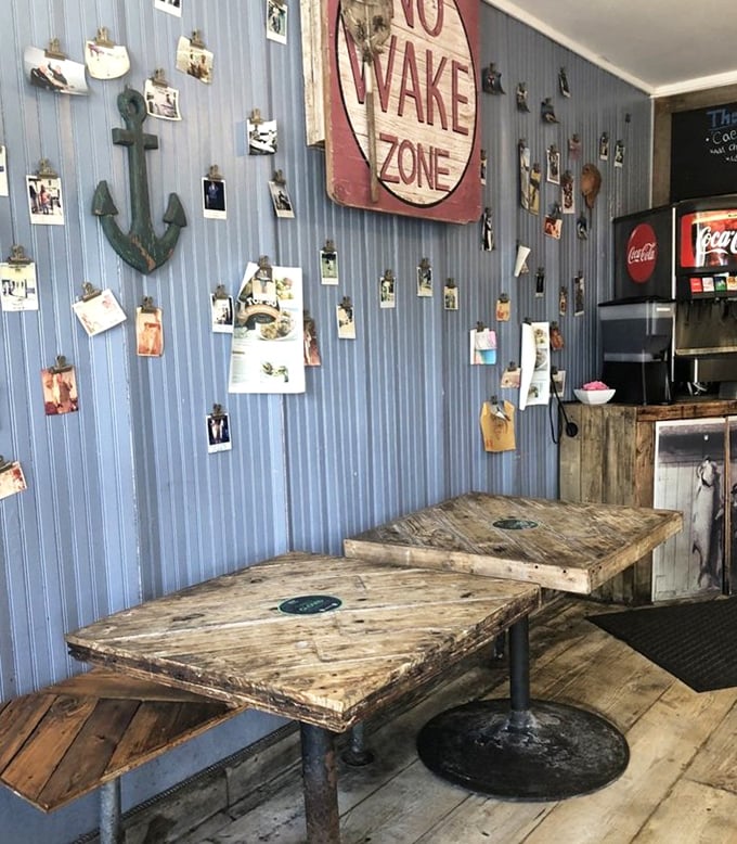 The blue-paneled walls adorned with photos tell stories of happy diners past, while the anchor reminds you this food didn't travel far to reach you.