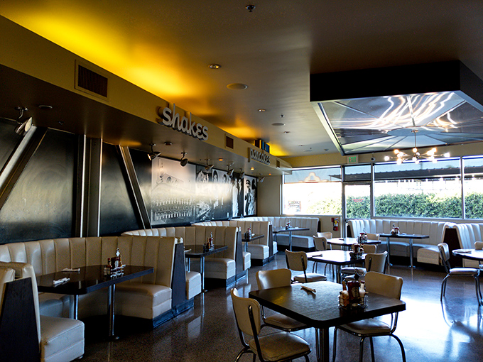 Sunshine streams through windows illuminating booths where memories are made between bites of double-deckers and sips of shakes.