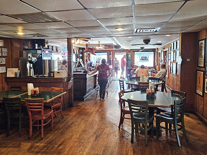 The warm glow of afternoon light streams through windows, illuminating wooden floors that have supported generations of barbecue pilgrims.