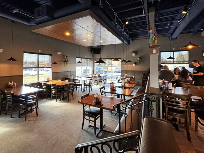 Modern industrial meets warm wood tones in this thoughtfully designed dining room where the focus remains squarely on what matters: the food.