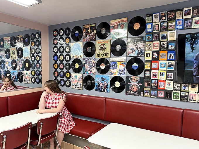 Album covers and vinyl records transform this wall into a jukebox you can see but not hear &ndash; the perfect backdrop for conversations about which decade had the best music.