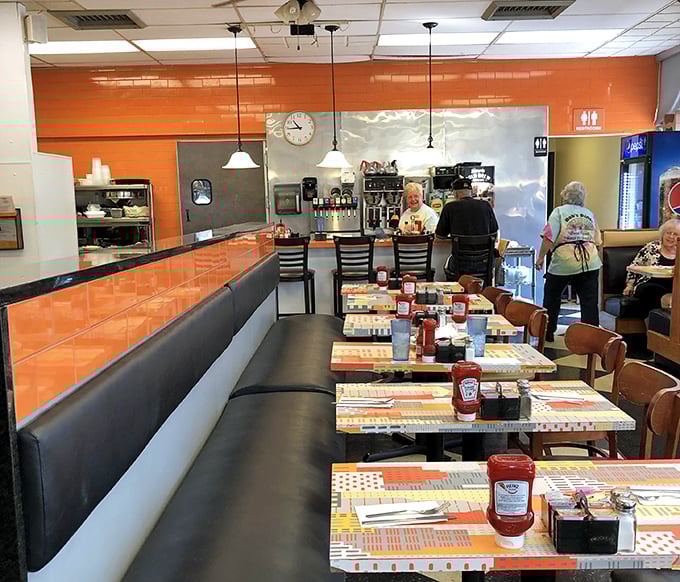 Orange walls that energize like a second cup of coffee&mdash;Bob's interior design philosophy seems to be "why be subtle when you can be sunny?" 