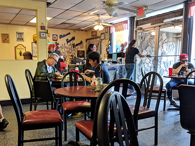 The bustling dining room where strangers become neighbors over the universal language of "please pass the hot sauce."
