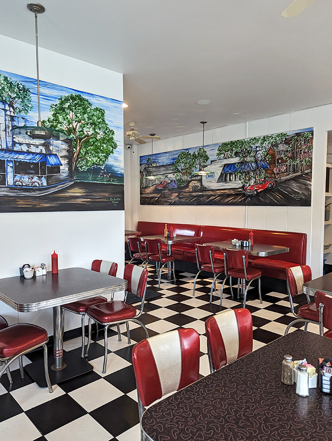 Red and white booths frame colorful murals depicting local scenes, creating the perfect backdrop for both first dates and "remember when" conversations spanning decades.