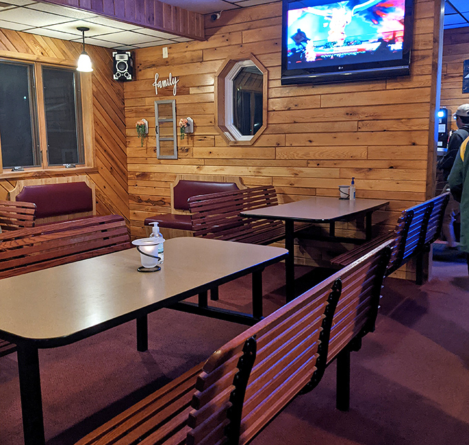 Wood-paneled walls and bench seating create that nostalgic supper club vibe that says, "Slow down, we've been doing this right for decades."