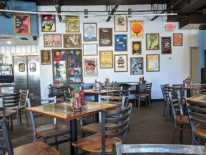 Concert posters transform ordinary walls into a visual playlist, creating the perfect backdrop for conversations that flow as easily as the coffee.