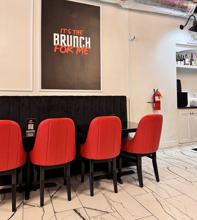 "IT'S THE BRUNCH FOR ME" isn't just wall art&mdash;it's the mantra you'll adopt after sinking into those striking red chairs.