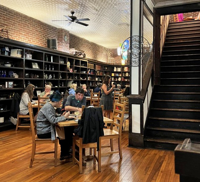 The dining room's second act reveals more brick, more charm, and stairs leading to who-knows-what delicious mysteries above.