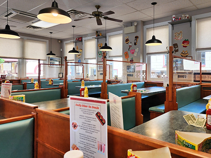 Teal booths and pendant lights create that perfect diner atmosphere where calories don't count and coffee refills are practically mandatory.