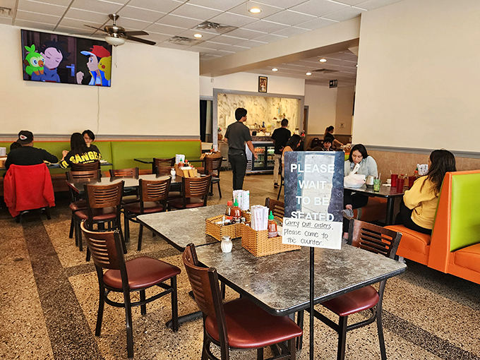 The dining room hums with the symphony of slurping, chopstick clicks, and satisfied murmurs &ndash; the universal language of good eating.