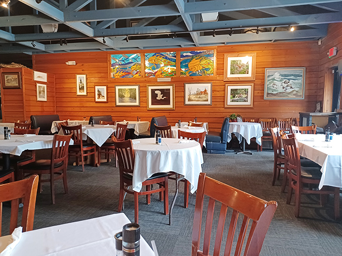 Local artwork and maritime decorations transform wooden walls into a gallery celebrating Florida's coastal heritage and artistic community.