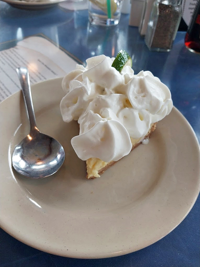 Key lime pie wearing a cloud of whipped cream like a jaunty hat&mdash;tart, sweet, and the perfect finale to a seafood feast.