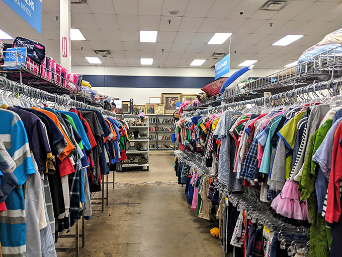 The children's clothing section: a rainbow of tiny garments that grow too small long before they wear out, now priced for practical parents.