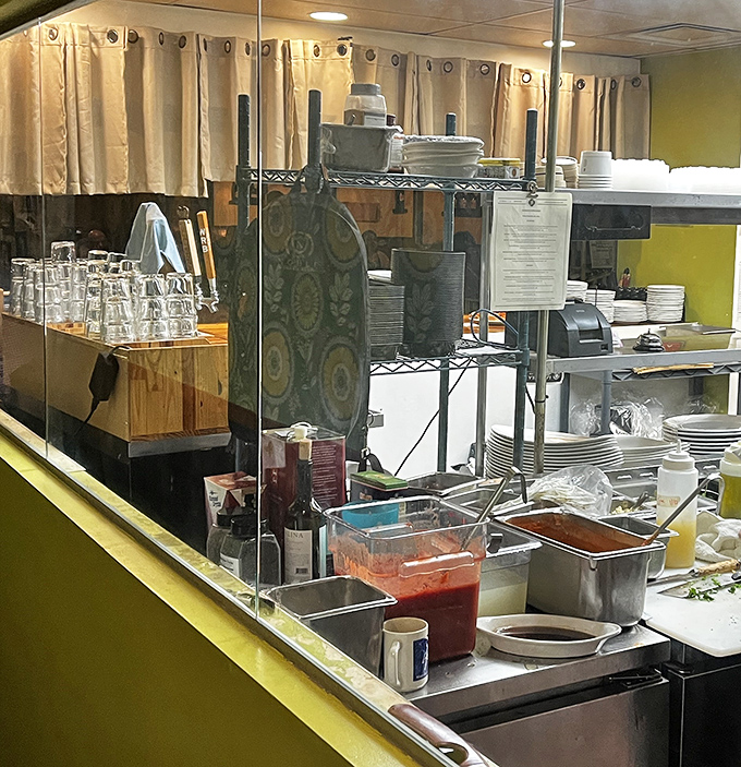 That open kitchen setup means you can watch your dinner being made, which is either reassuring or dangerous for your appetite.