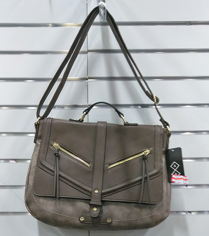 This leather crossbody bag looks like it walked off a runway instead of into a thrift store at this price.