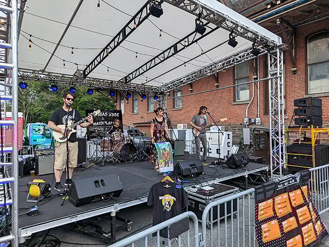 Live music transforms the outdoor space into something between a block party and a concert, with better food than either typically offers.