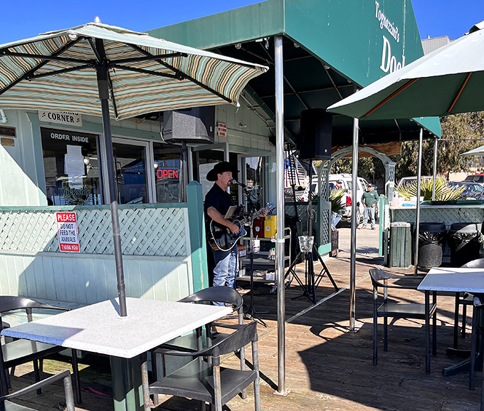 Live music and sunshine &ndash; because great seafood deserves a soundtrack. This guitarist provides the perfect tunes to your chowder-slurping symphony.