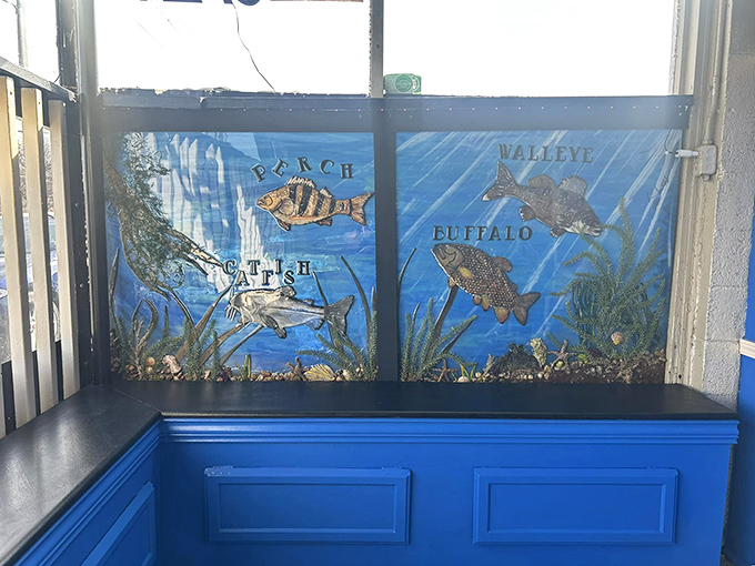 Underwater artwork brings the ocean to Kansas. These painted fish swim permanently in a sea of blue, tempting you with their fried counterparts.