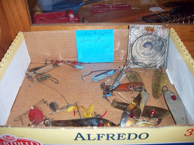 Fishing lures nestled in their makeshift Alfredo pasta box home. Each one designed to catch fish&mdash;but today they've caught your attention instead.