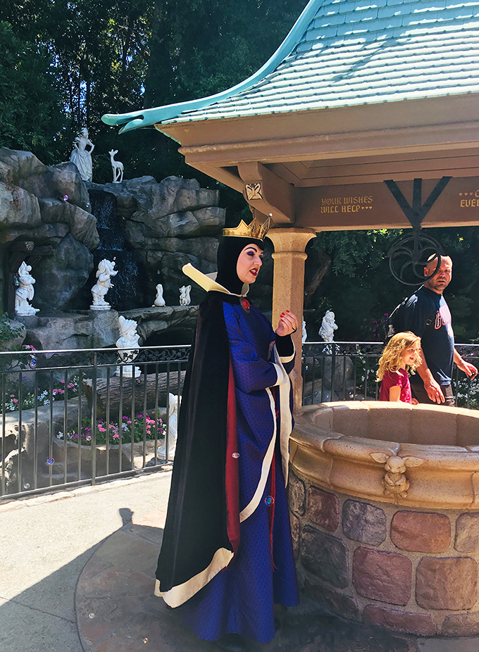 The wishing well area features character performers bringing villains to life, proving some fairy tales need their delicious darkness.