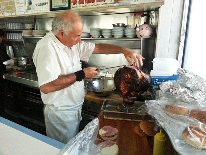 The art of ham carving elevated to performance. Each slice must meet the exacting standards that have kept customers returning for generations.