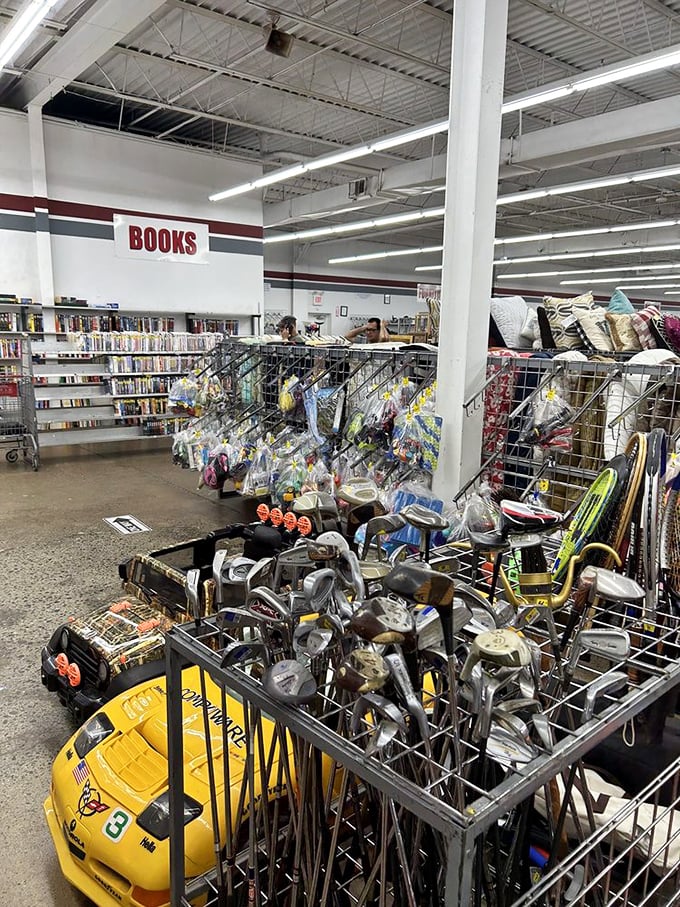 The books section neighbors sporting goods in a marriage of mind and body. Those golf clubs are practically begging for a second chance at glory.