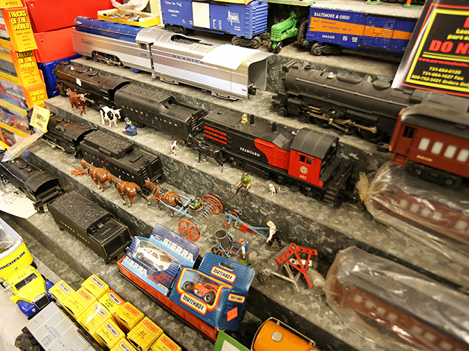 This miniature train display would make any grown adult suddenly remember why they begged Santa for that Lionel set.