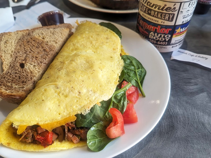 An omelet should be a canvas, and this one is painted with vibrant vegetables and protein. Paired with that perfectly toasted bread, it's breakfast artistry at its finest.