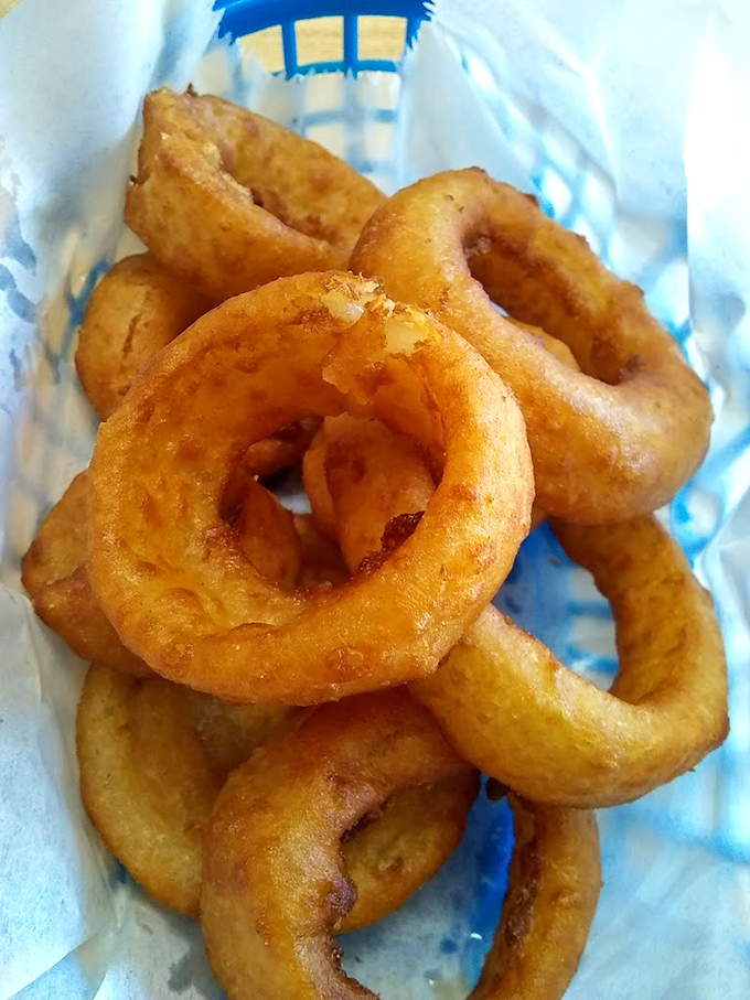 Onion rings so perfect they make you wonder why we bother with jewelry. These golden halos are what angels snack on.