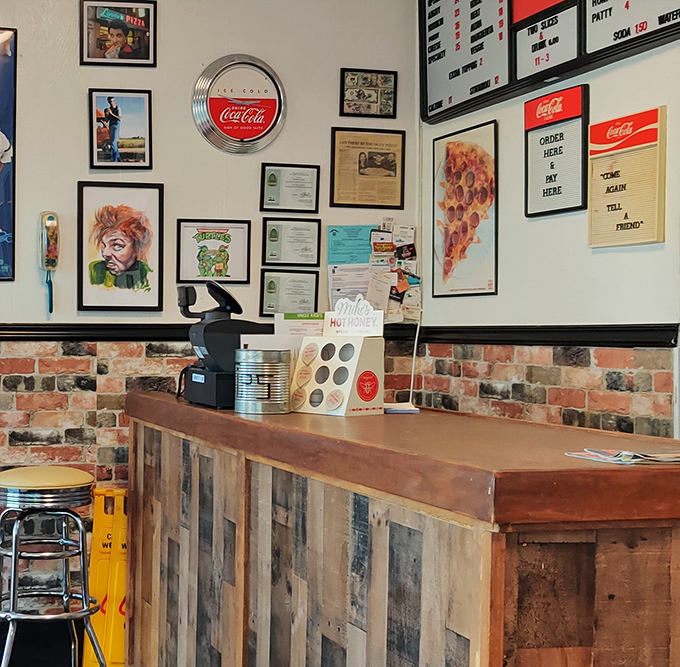 The counter where dreams come true &ndash; complete with vintage Coca-Cola signs and a wall of memories. Pizza history in the making.