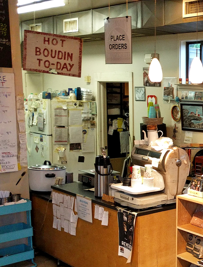 The order counter where magic begins, complete with handwritten specials and that "Hot Boudin To-Day" sign demanding your immediate attention.