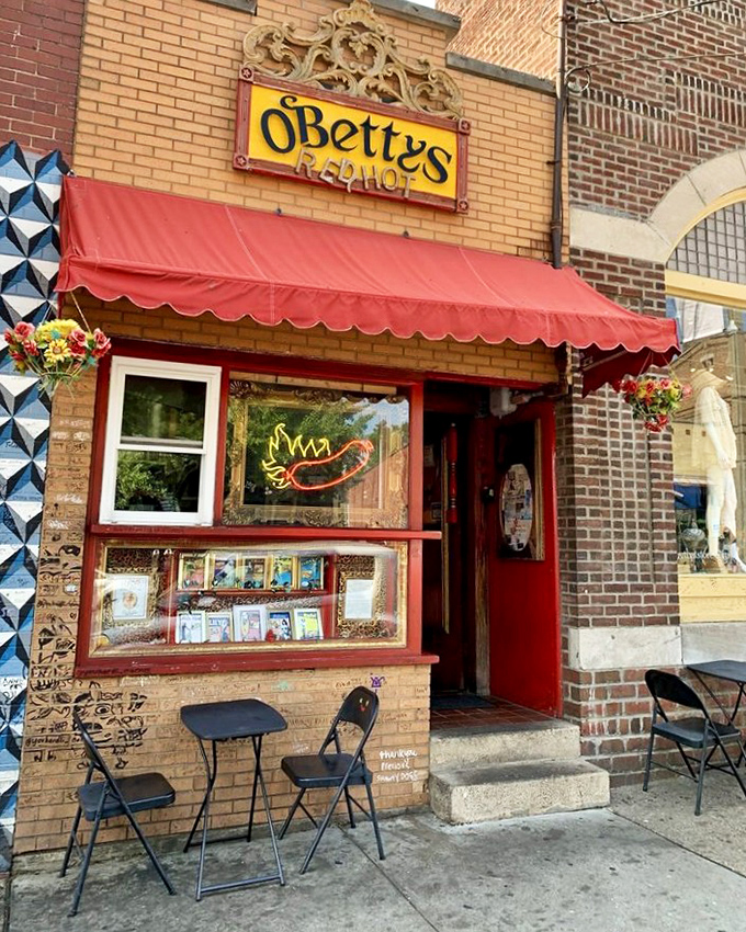 The exterior might be humble, but that red awning serves as a beacon for hot dog aficionados seeking Athens' most celebrated tubular treasures.