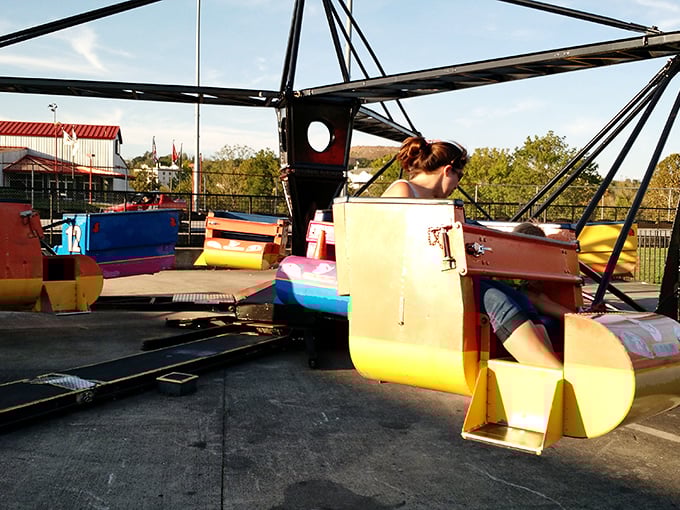 Nothing says "I'm having fun shopping" like taking a break on a carnival ride that spins fast enough to make you forget how much you've spent.