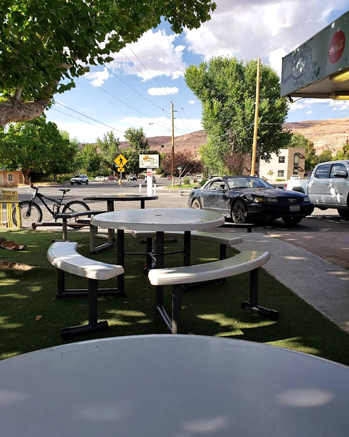Outdoor seating that lets you enjoy your meal while contemplating the red rocks in the distance.